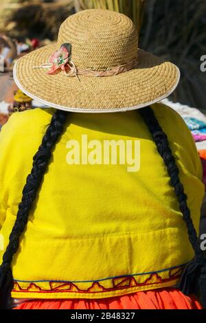 Quechua women with traditional braided hair and bowler hats ...