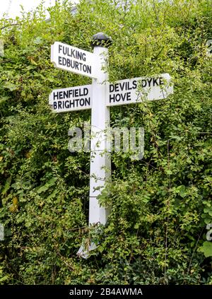 A traditional old directions sign post outside St Nicholas church in ...