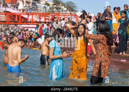 Hindu pilgrimage ritualistic bathing at the Ganges river at Haridwar ...