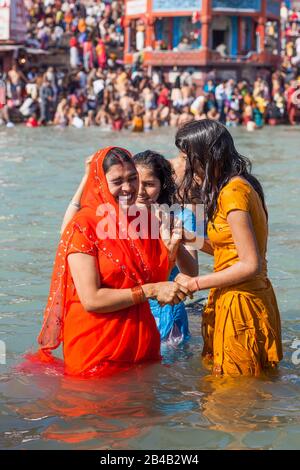 Hindu pilgrimage ritualistic bathing at the Ganges river at Haridwar ...