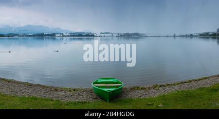 Boat at lakeshore of lake Hopfensee, Fuessen, Allgaeu, Bavaria, Germany ...