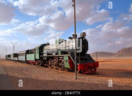 Historic disused railway train with steam locomotive in Wadi Rum east ...