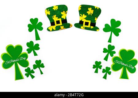 St Patricks Day festive background. Green quatrefoils and bow tie on ...