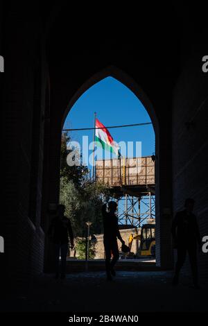 An ancient stone castle with Iraqi flag and clouds in sky Stock Photo ...