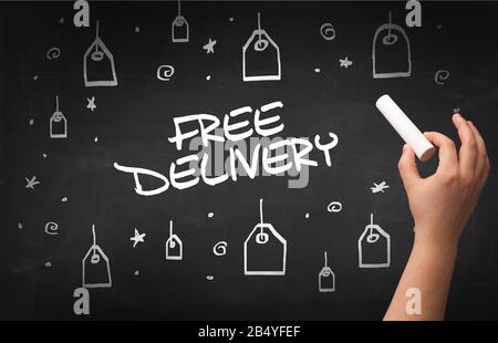 Hand drawing FREE DELIVERY inscription with white chalk on blackboard ...