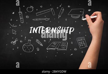 Hand drawing INTERNSHIP inscription with white chalk on blackboard ...