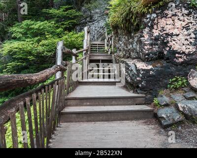 Wooden stairs and railing at Bushkill Falls in the Pocono Mountains of ...