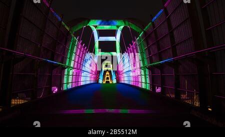 Bright led illuminate pedestrian walkway over highway at night Stock ...