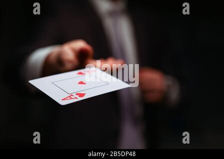 Hidden ace in black jacket Stock Photo - Alamy