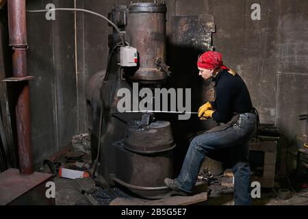 Female blacksmith working in workshop Stock Photo: 104722330 - Alamy