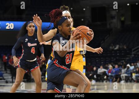 St. John's guard Qadashah Hoppie, right, talks to teammates as she ...