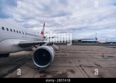 Jet propelled airplane during a boarding process at an aerodrome Stock ...