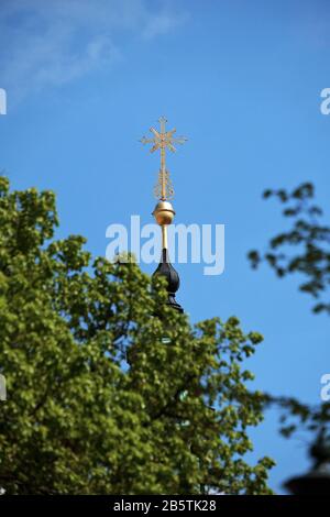 Church Dome and Cross. Dome and cross atop a baroque church, serene sky ...