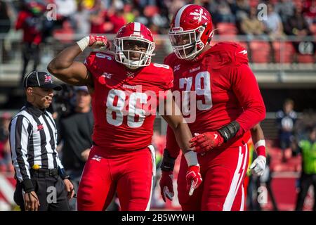 St. Louis Battlehawks tight end Tyler Neville, left, runs after ...