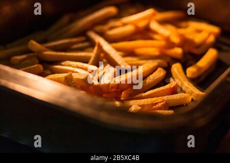 pile of french fries on baking paper Stock Photo - Alamy