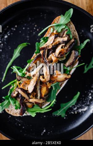 Fried shiitake mushrooms, food photography with black background Stock ...