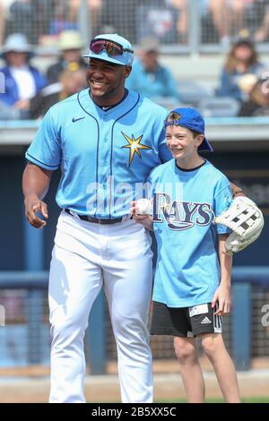 A young fan poses in a Tampa Bay Buccaneers prop helmet during a NFL ...