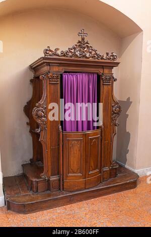 old confessional box in Italian church with red curtain Stock Photo - Alamy