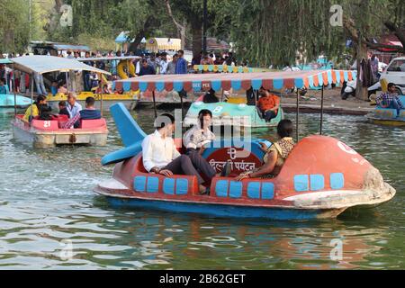 People enjoying boating in an artificial lake near India Gate in New ...