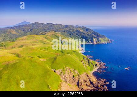 Coastal landscape, Rebun Island and Rishiri island in distance ...