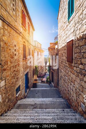 Beautiful street with flowers in the Hvar town, Hvar island, Dalmatia ...