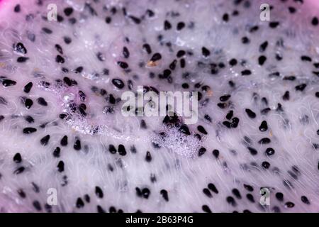 White pulp with black seeds of the white-fleshed Pitaya or Dragon fruit ...