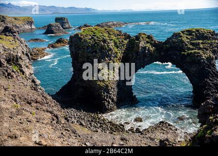 Gatklettur Arch Rock at Hellnar, near Arnarstapi on the Snaefellsnes ...