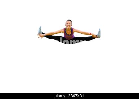 Gymnast doing the splits on a balance beam Stock Photo - Alamy