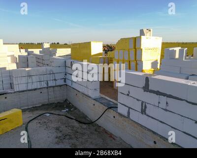 First stages of building a house. Half build from silicate blocks Stock ...