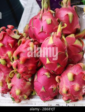 Dragon fruit. Lots of dragon fruits in the shop Stock Photo - Alamy