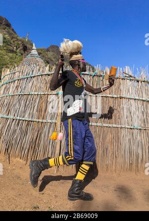 Larim tribe man dancing during a wedding ceremony, Boya Mountains ...