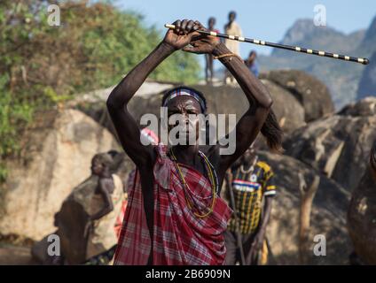 Larim tribe woman dancing during a wedding celebration, Boya Mountains ...