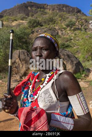 Larim tribe woman dancing during a wedding celebration, Boya Mountains ...