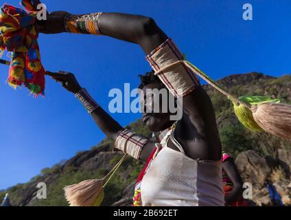 Larim tribe woman dancing during a wedding celebration, Boya Mountains ...