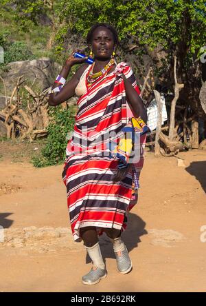 Larim tribe woman dancing during a wedding celebration, Boya Mountains ...