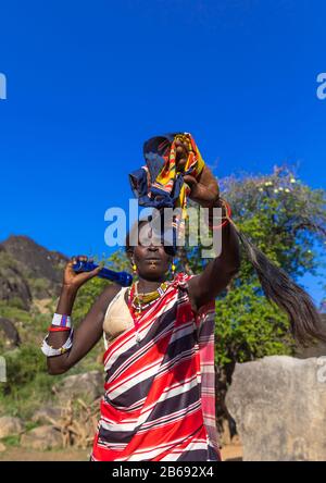 Larim tribe woman dancing during a wedding celebration, Boya Mountains ...