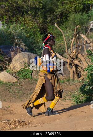 Larim tribe woman dancing during a wedding celebration, Boya Mountains ...