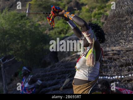 Larim tribe woman dancing during a wedding celebration, Boya Mountains ...