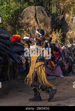 Larim tribe woman dancing during a wedding celebration, Boya Mountains ...