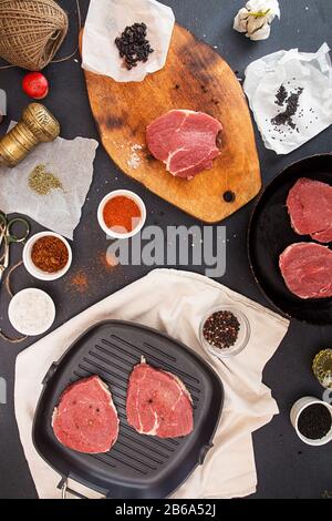 Raw pork meat for baking over wooden background Stock Photo - Alamy