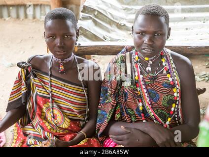 Toposa tribe women in traditional clothing dancing during a ceremony ...