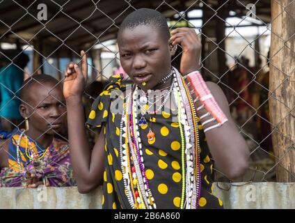 Toposa tribe women in traditional clothing dancing during a ceremony ...