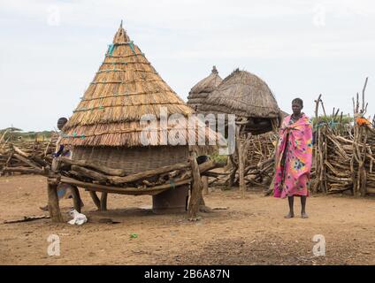 Toposa tribe women standing near a granary in a village, Namorunyang ...
