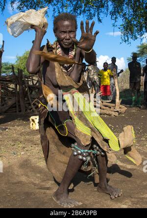 Toposa tribe woman in traditional clothing dancing during a ceremony ...