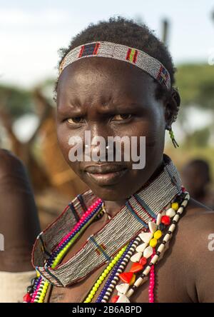 Portrait of a sudanese Toposa tribe woman refugee with huge necklaces ...