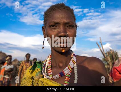 Portrait of a sudanese Toposa tribe woman refugee with huge necklaces ...