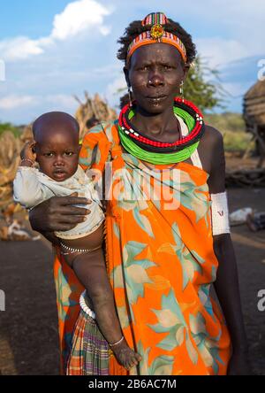 Toposa tribe woman carrying her baby in a sling, Namorunyang State ...