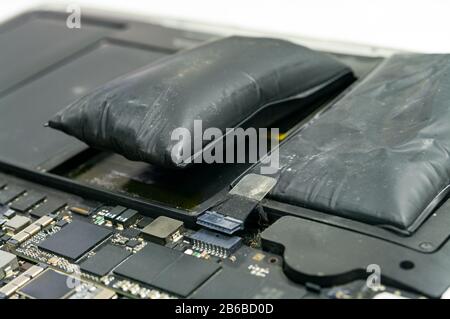 Lithium-ion laptop battery that has swollen Stock Photo - Alamy
