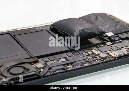 Lithium-ion laptop battery that has swollen Stock Photo - Alamy