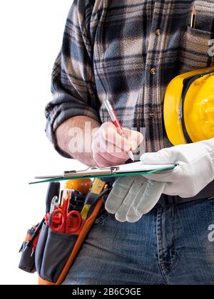 Carpenter electrician holds helmet and protective goggles in hand ...
